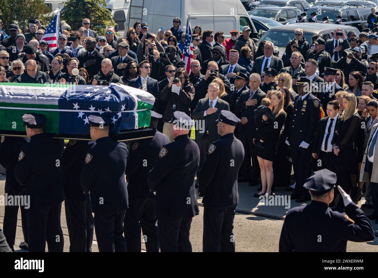 Jonathan Diller's wife Stephanie Diller and her son watch the casket ...