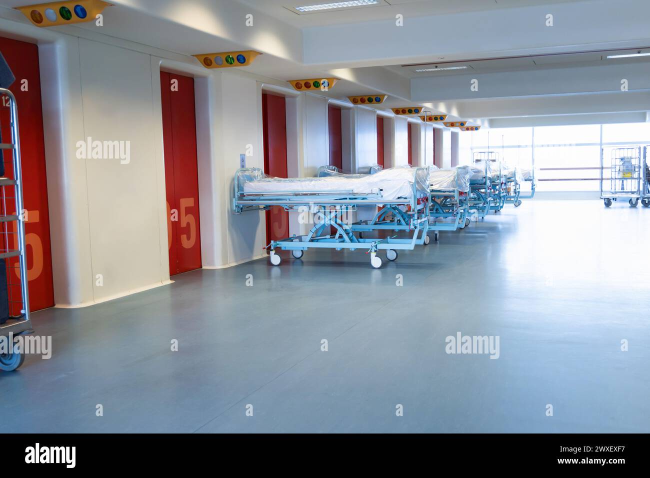 Clean hospital beds covered with film, ready for new patients. Hospital ...