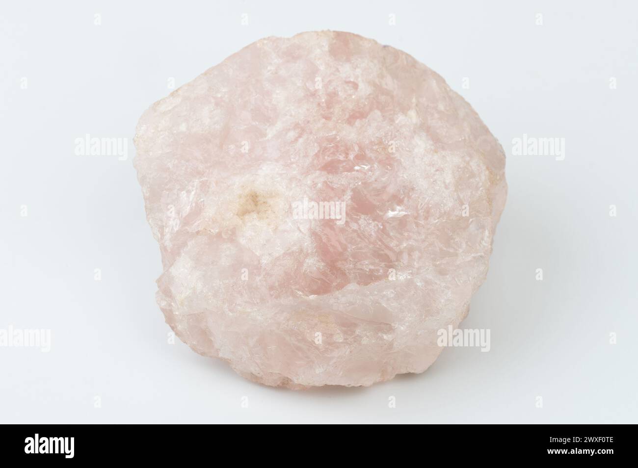 Pink color mineral gem rock stone isolated on white studio background ...