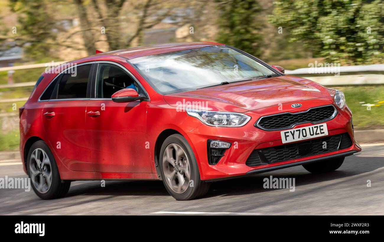 Milton Keynes,UK-Mar 30th 2024: 2020 red Kia Ceed car driving on a ...