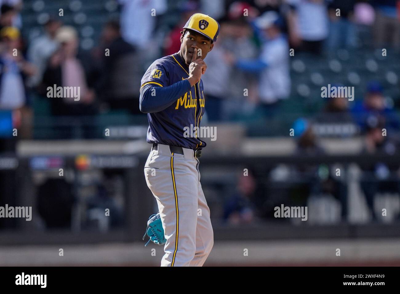Milwaukee Brewers relief pitcher Abner Uribe gestures toward the New ...