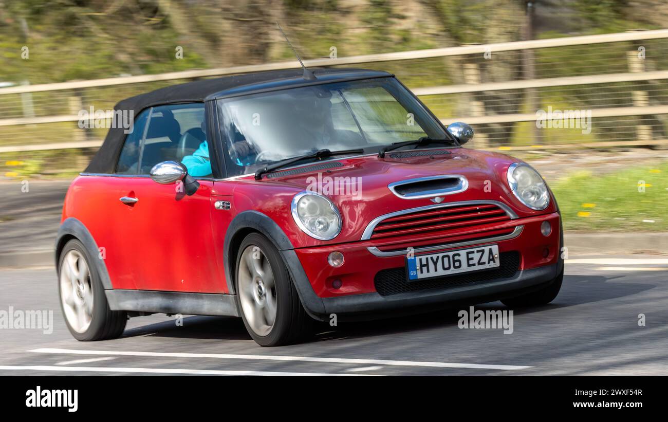 Milton Keynes,UK-Mar 30th 2024: 2006 red Mini Cooper S car driving on a ...