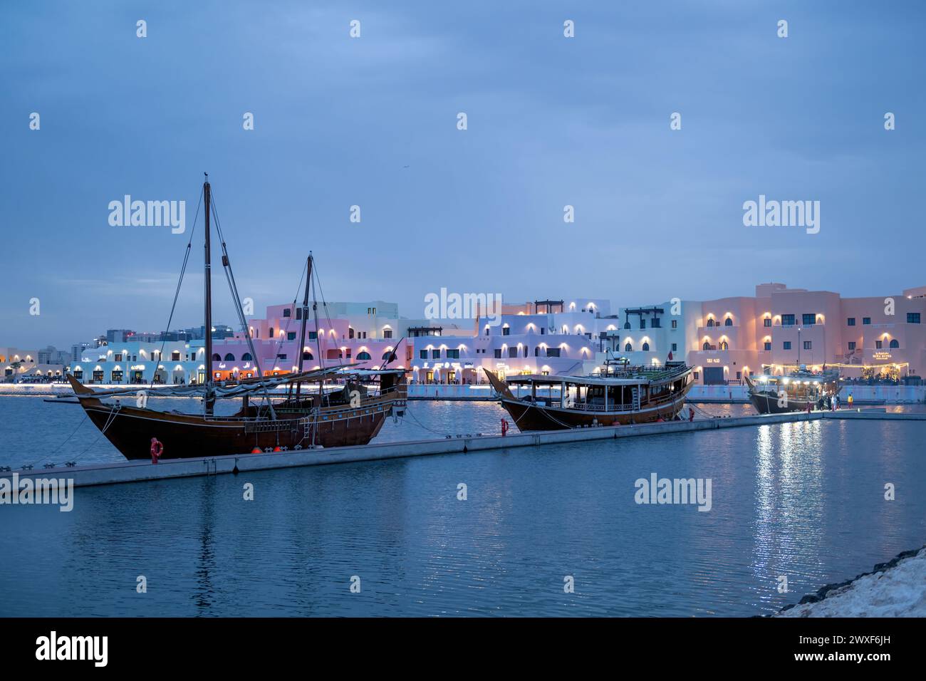 Traditional Dhow boat anchored in the Mina Port known as old Doha port ...