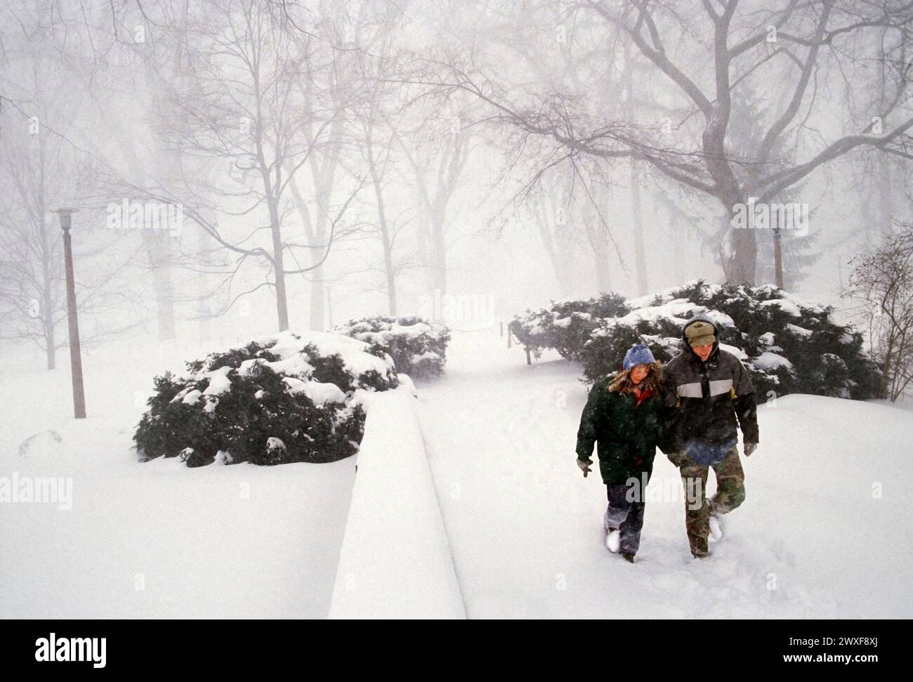 Student couple brave a winter snow storm on the campus of Pennsylania ...