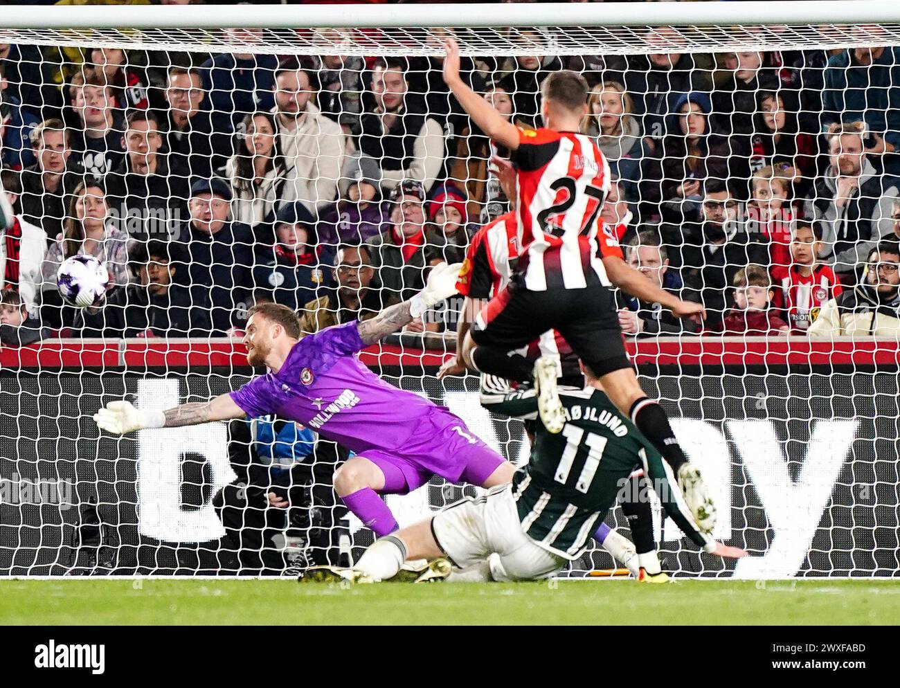 Brentford goalkeeper Mark Flekken makes a save during the Premier ...