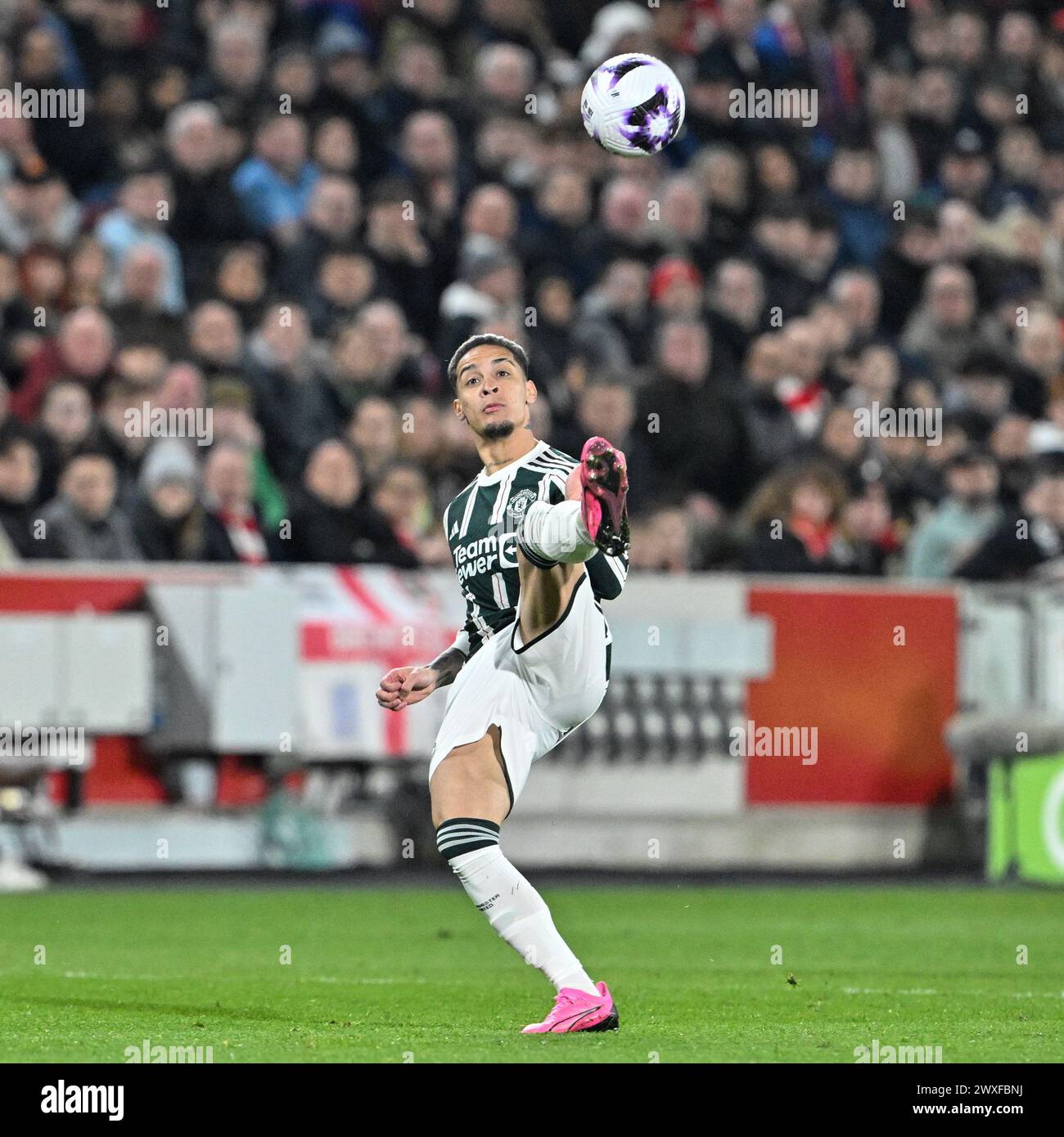 Antony of Manchester United attempts to control the ball during the ...
