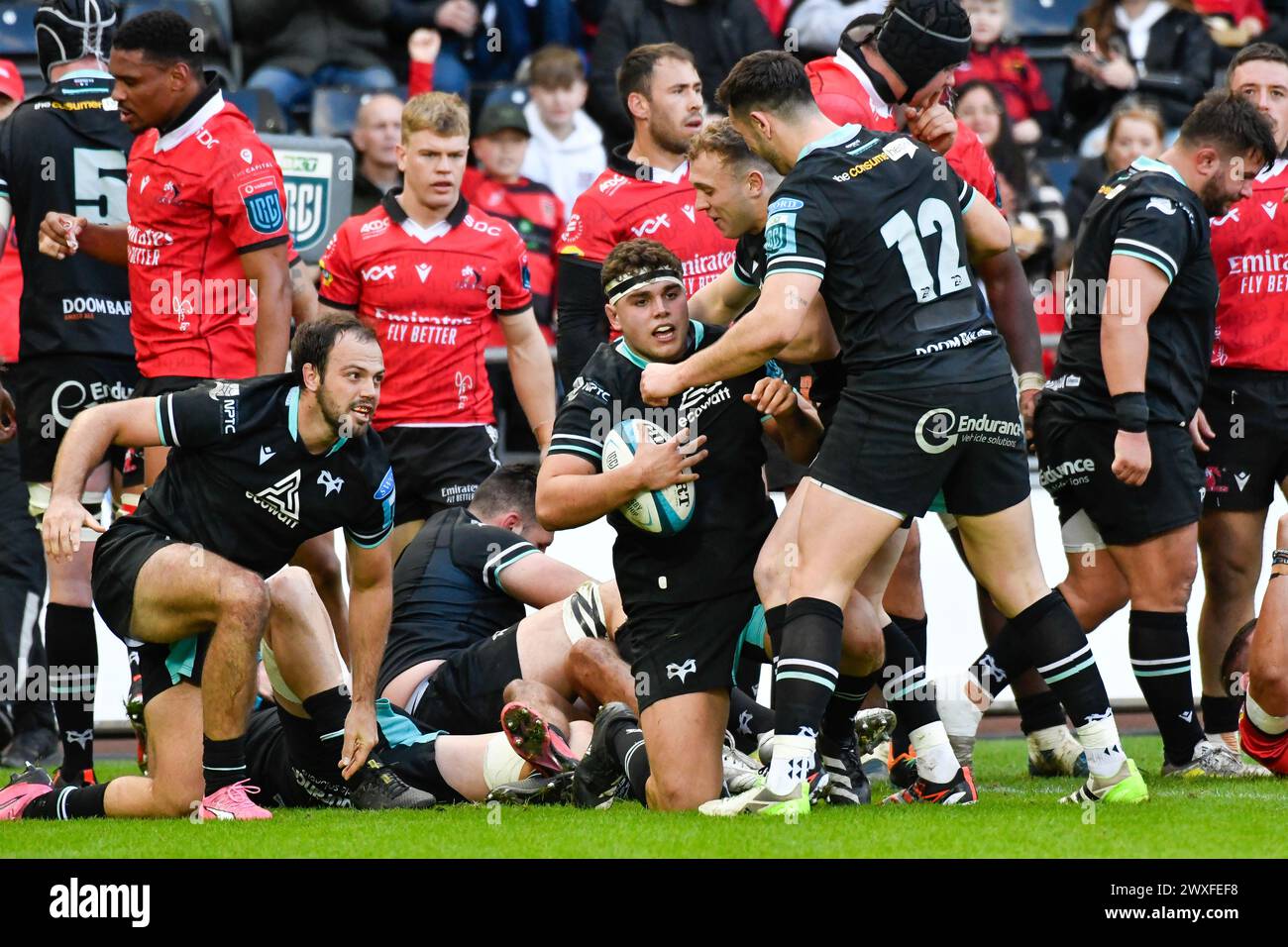 Swansea, Wales. 30 March 2024. Lewis Lloyd of Ospreys celebrates ...