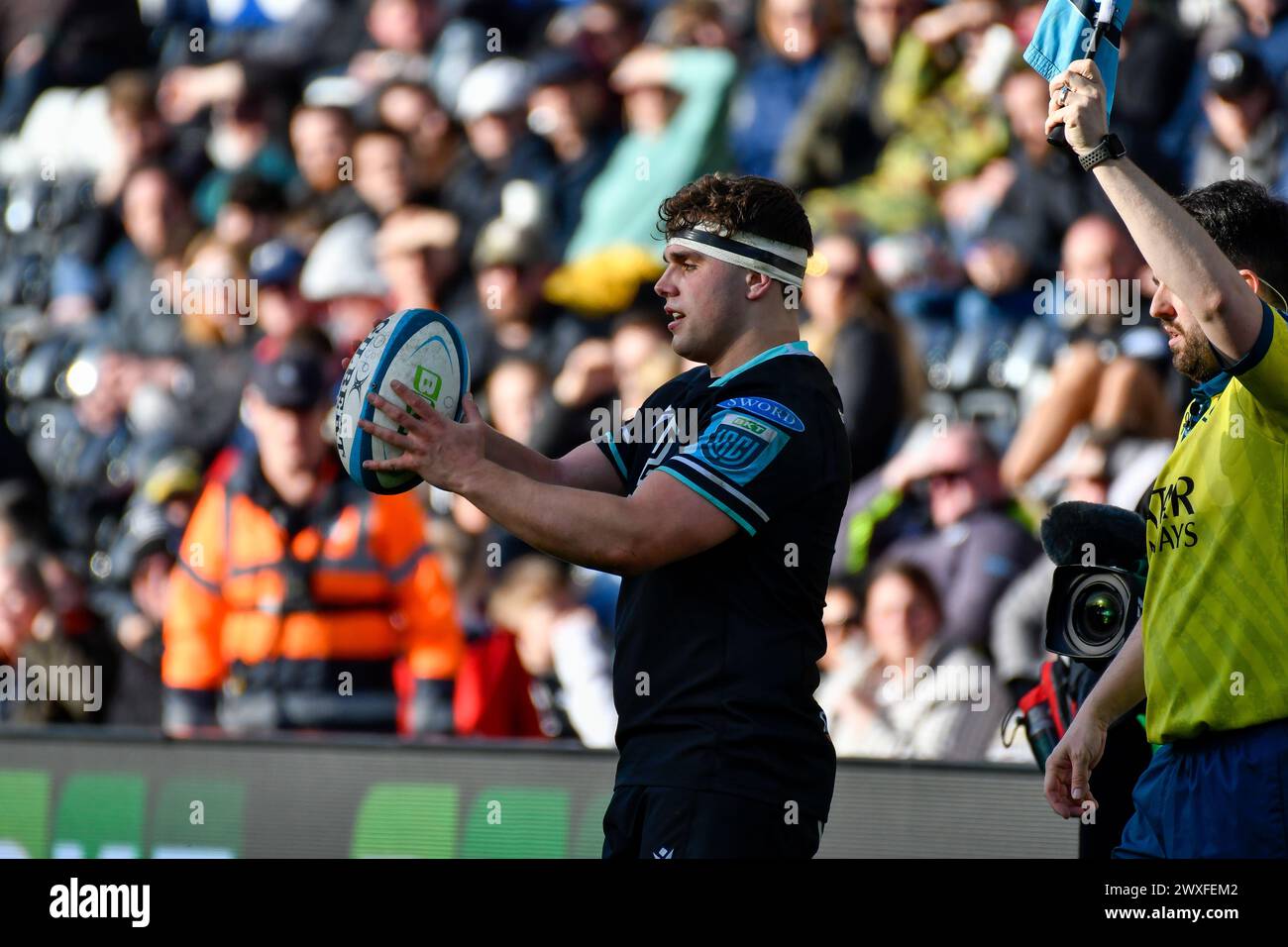 Swansea, Wales. 30 March 2024. Lewis Lloyd of Ospreys about to throw in ...
