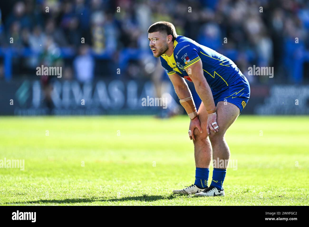 Danny Walker of Warrington Wolves takes a breather during the Betfred ...