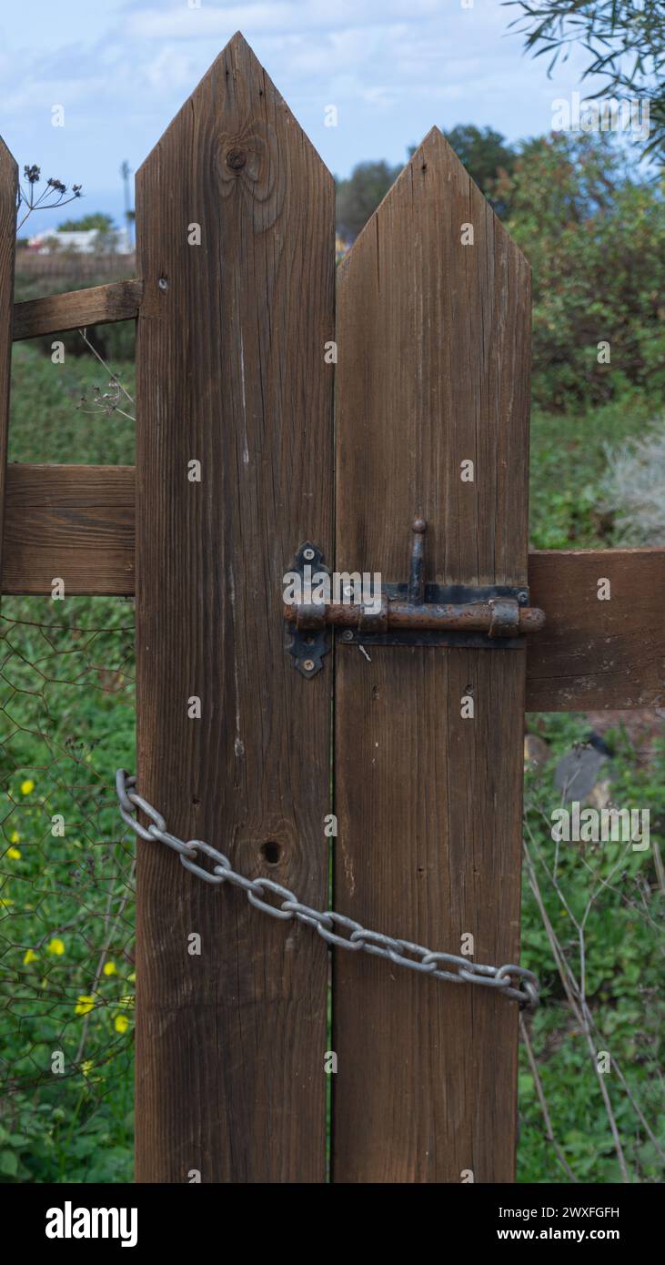 Vintage wooden gate, rustic security, tranquil rural scene Stock Photo ...