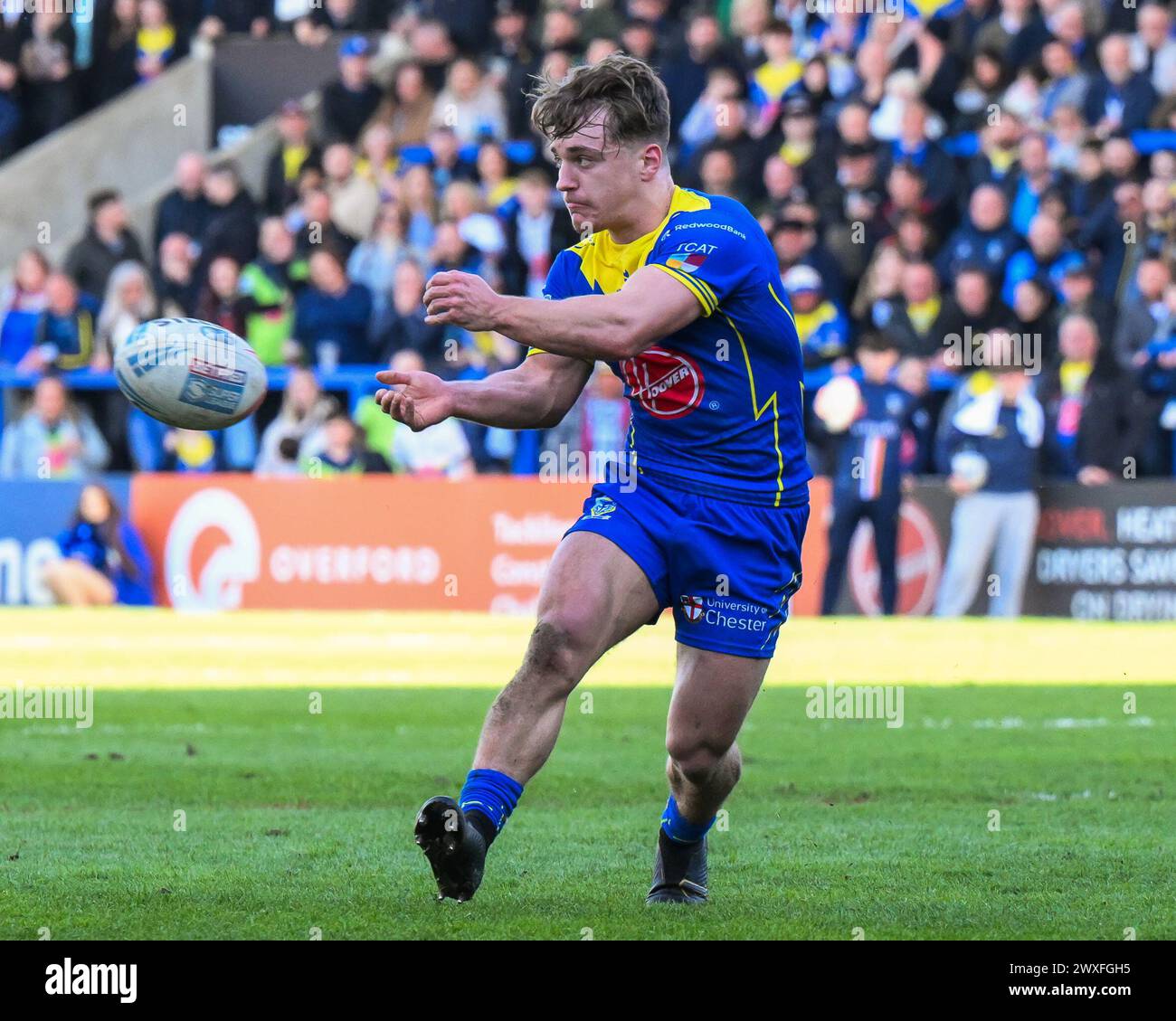 Leon Hayes of Warrington Wolves passes the ball during the Betfred ...