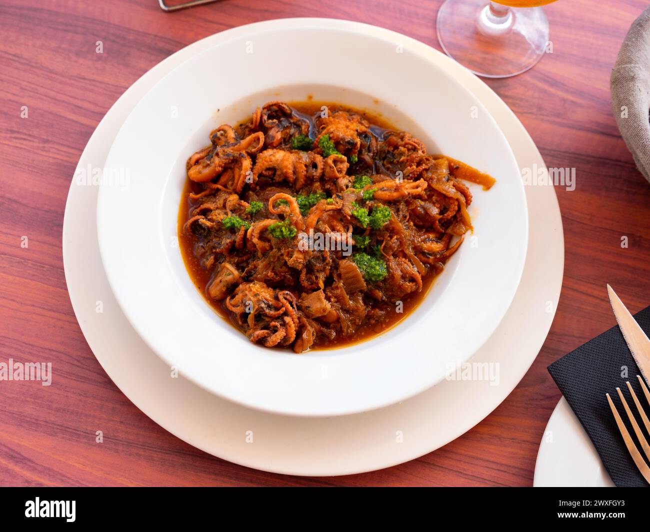 Pulpitos encebollados, traditional spanish onion soup with baby ...