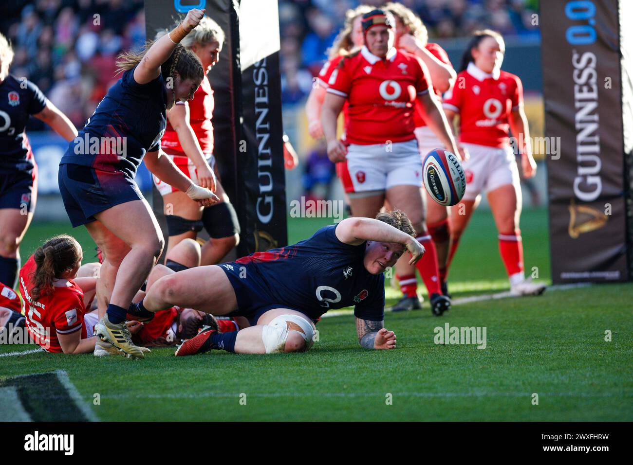 Hannah Botterman (Bristol Bears) launches herself over to score a try ...