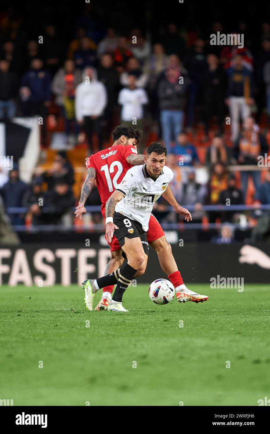 Samu Costa of RCD Mallorca, Hugo Duro Valencia CF in action during the ...
