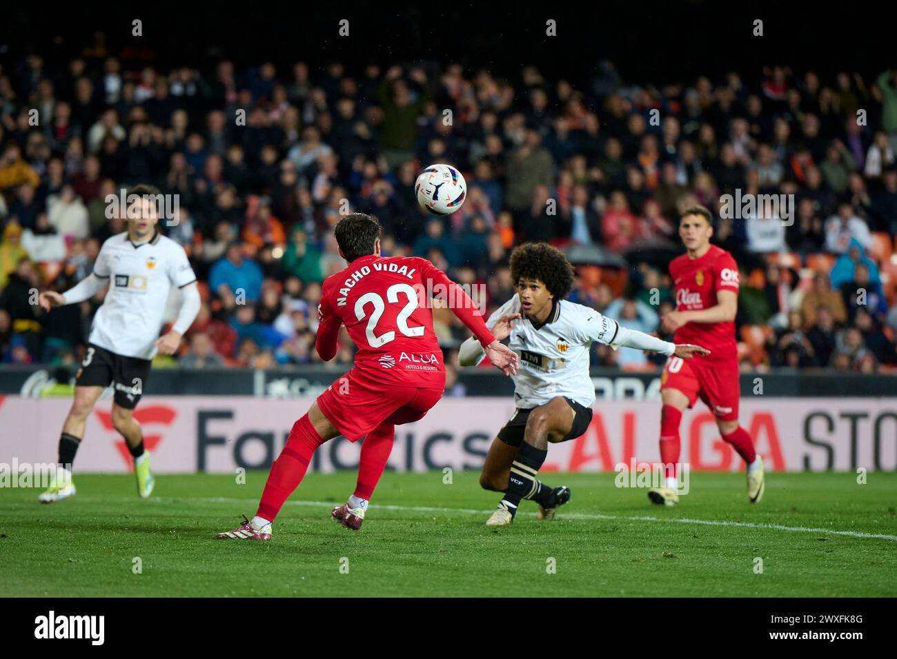 Peter Gonzalez of Valencia CF, Nacho Vidal of RCD Mallorca in action ...