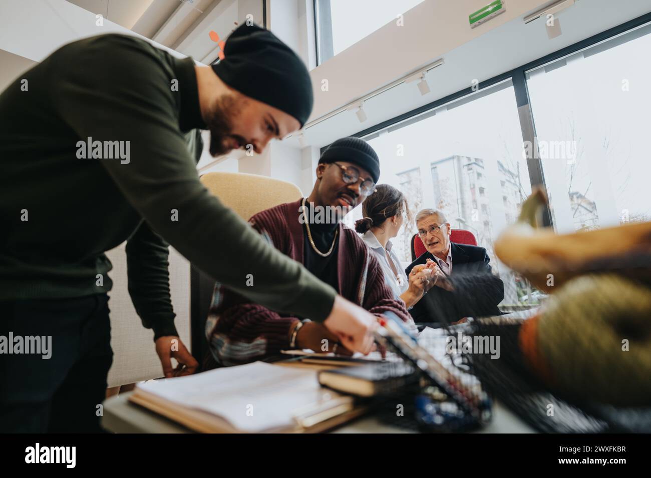 Multicultural colleagues engage in a productive brainstorming session ...