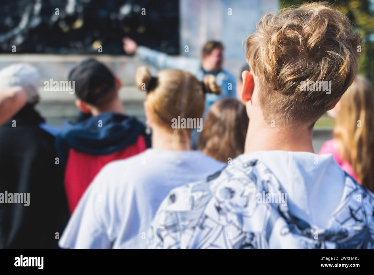 Group of students and school pupils on outdoor excursion tour in the ...