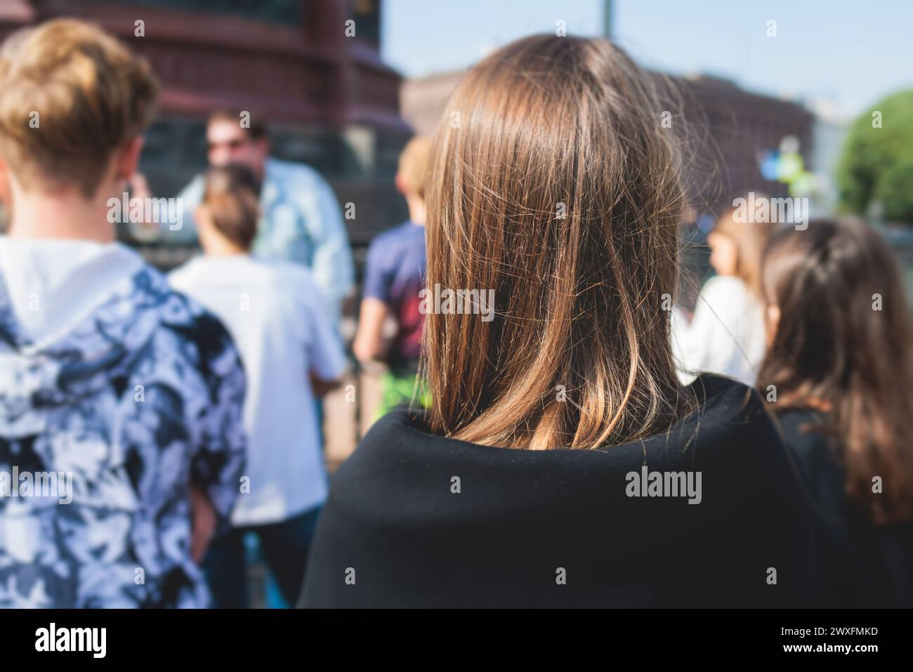 Group of students and school pupils on outdoor excursion tour in the ...