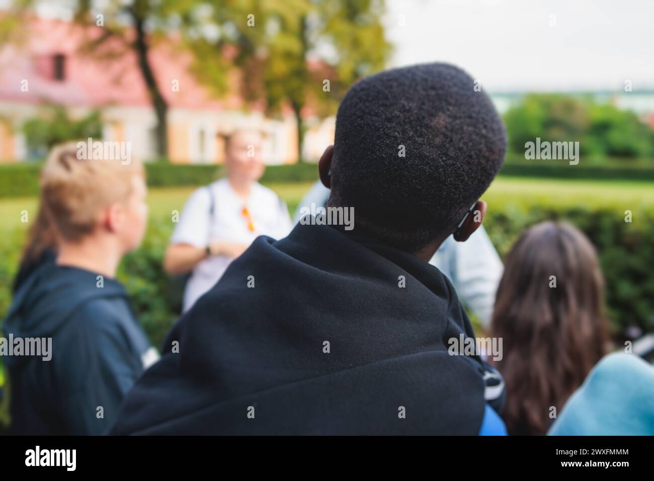 Group of students and school pupils on outdoor excursion tour in the ...