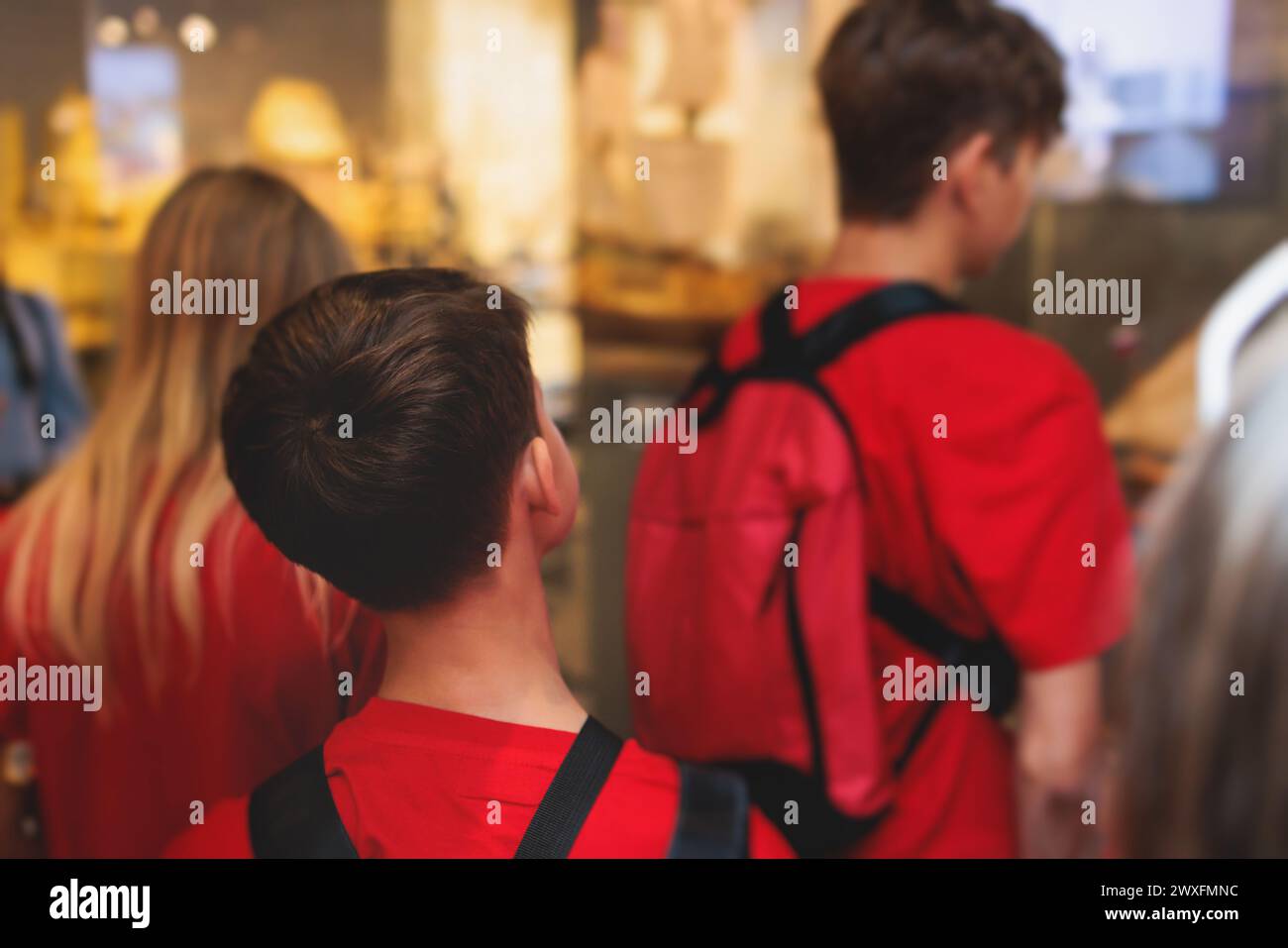 Group of students and school pupils in a science museum exhibition ...