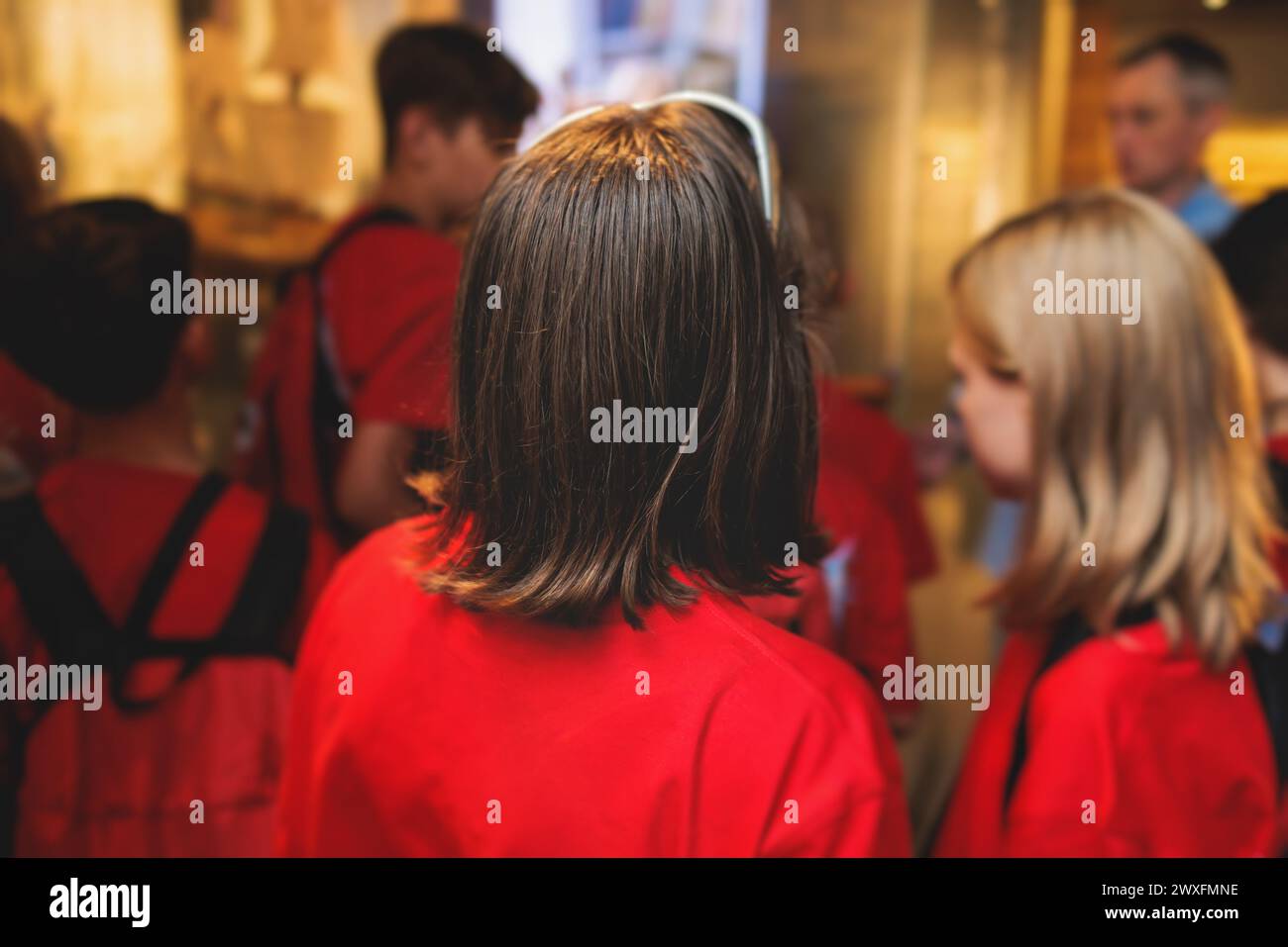 Group of students and school pupils in a science museum exhibition ...