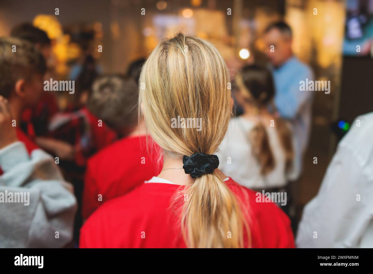 Group of students and school pupils in a science museum exhibition ...