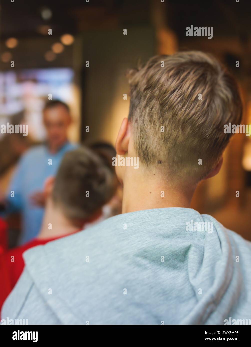 Group of students and school pupils in a science museum exhibition ...