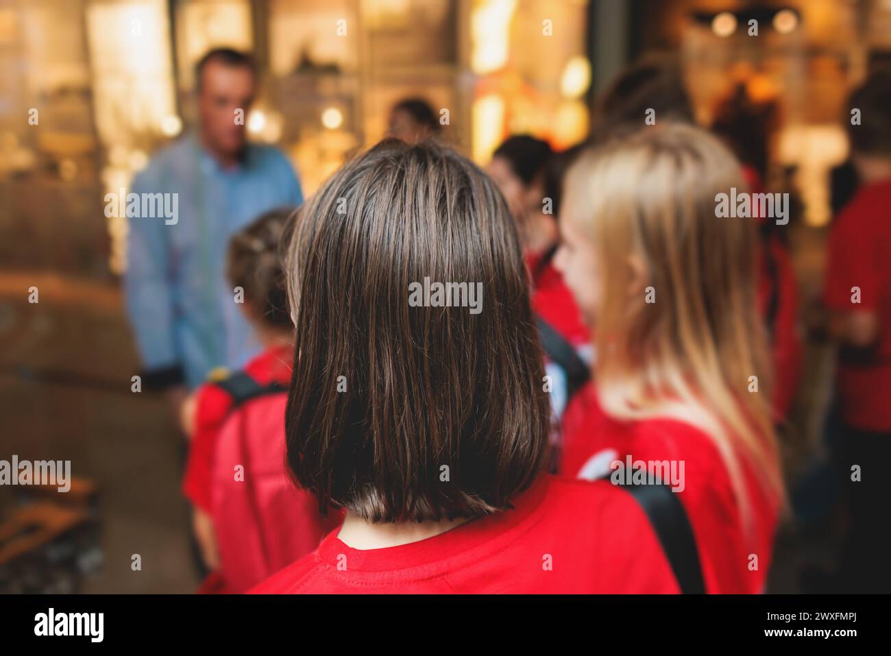 Group of students and school pupils in a science museum exhibition ...