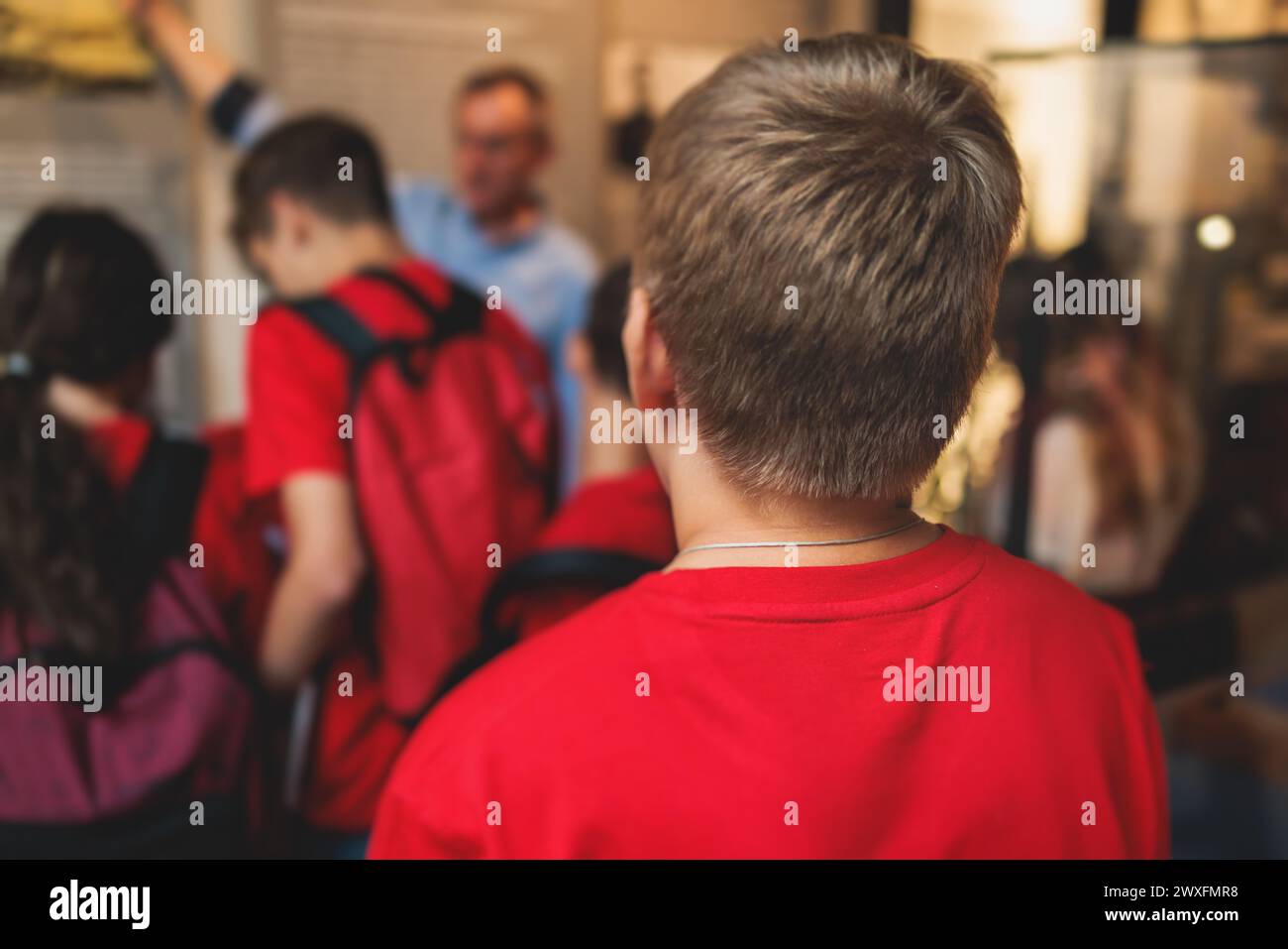 Group of students and school pupils in a science museum exhibition ...
