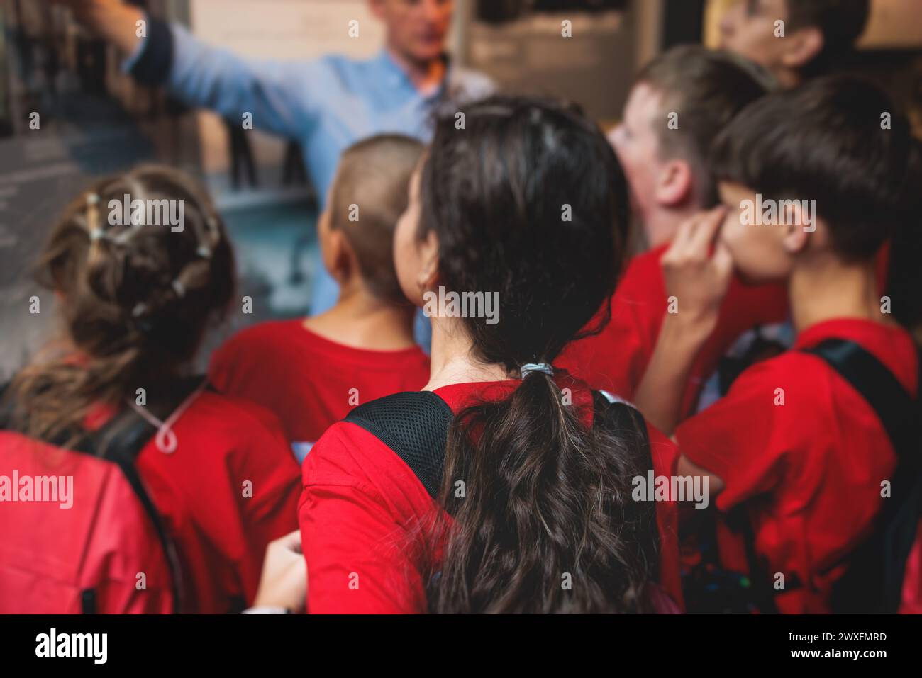 Group of students and school pupils in a science museum exhibition ...