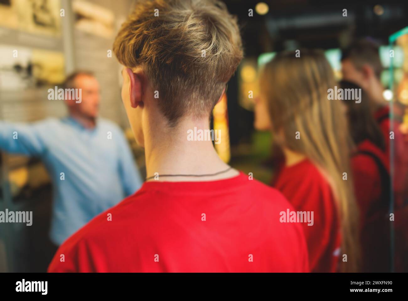 Group of students and school pupils in a science museum exhibition ...