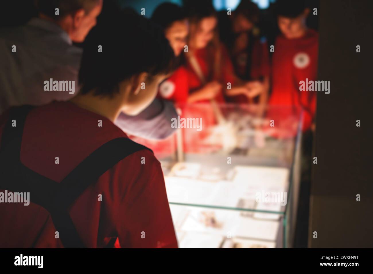 Group of students and school pupils in a science museum exhibition ...