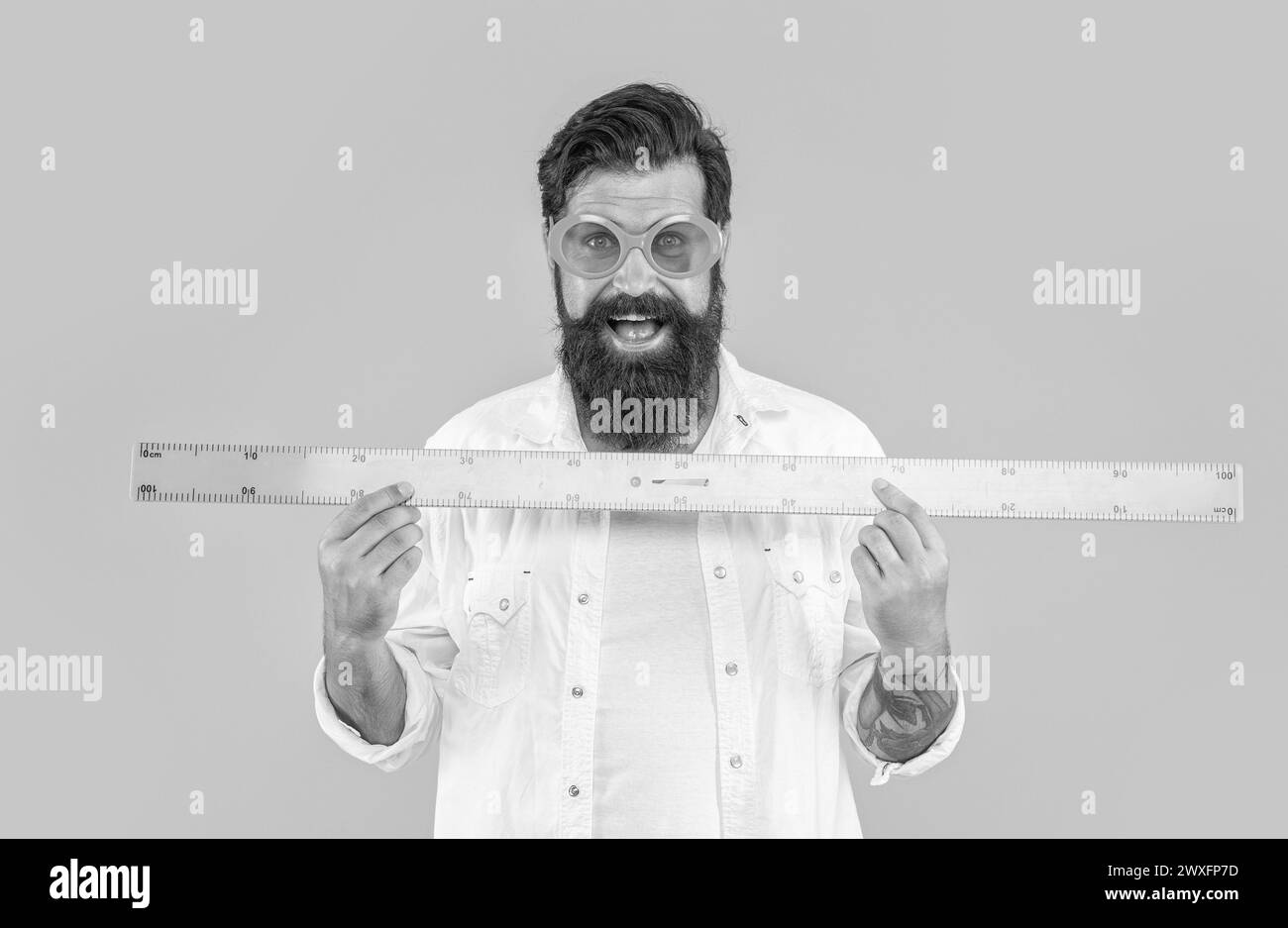 happy man hold geometry ruler isolated on yellow. man hold geometry ...