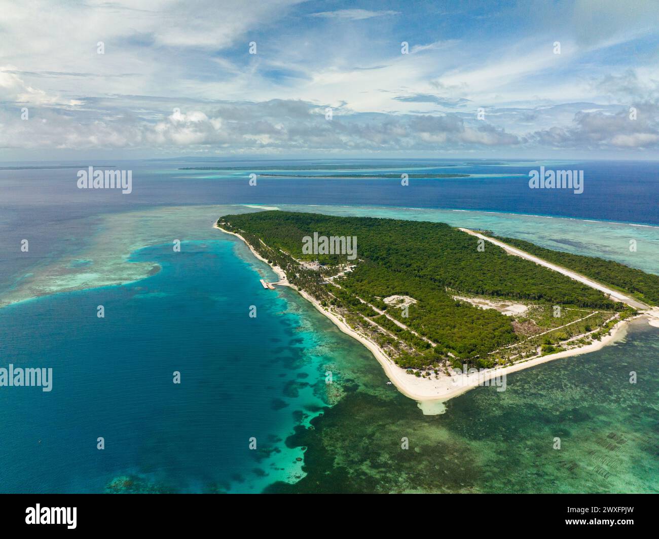 Aerial drone of island with beautiful beach, palm trees by turquoise ...
