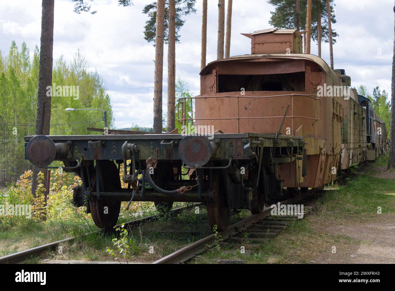 Old Finnish armored train from WW2 period on museum track on a summery ...