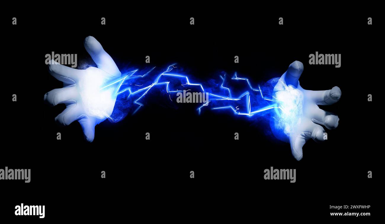 Magician performing magic trick on black background, closeup. Banner ...