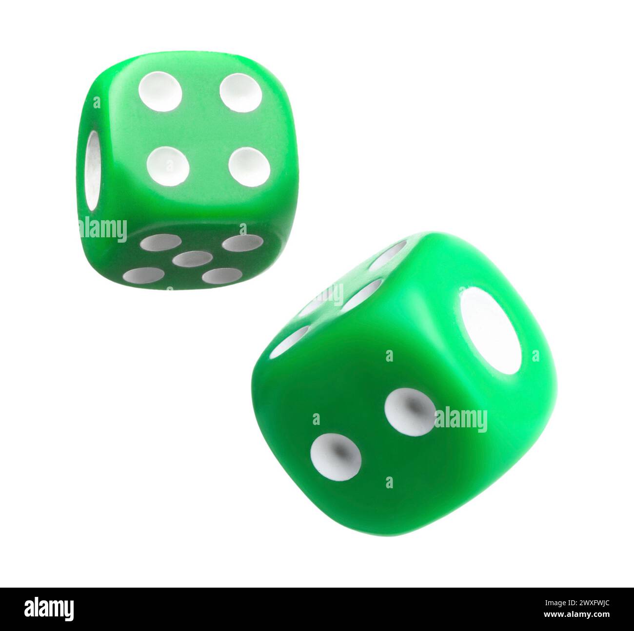Green dice in air on white background Stock Photo - Alamy
