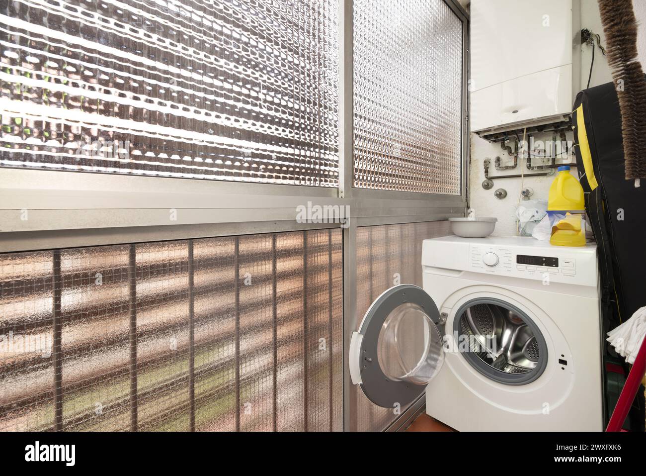 small laundry terrace with washing machine, aluminum window with ...