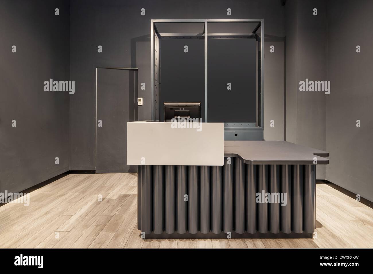 Empty clothing store counter with cash register Stock Photo - Alamy