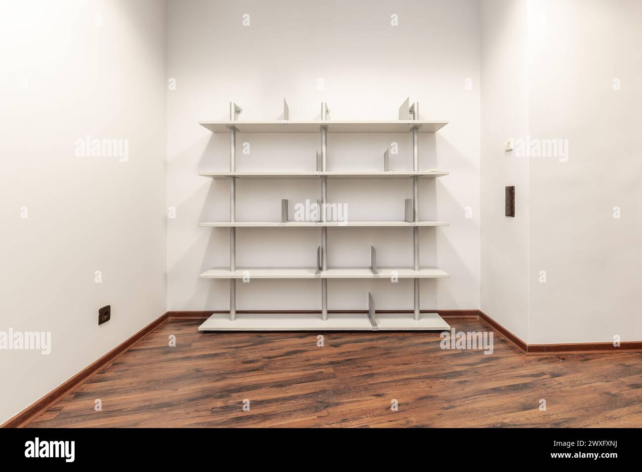 An empty office with a shelf of white cloth and a structure of metal ...