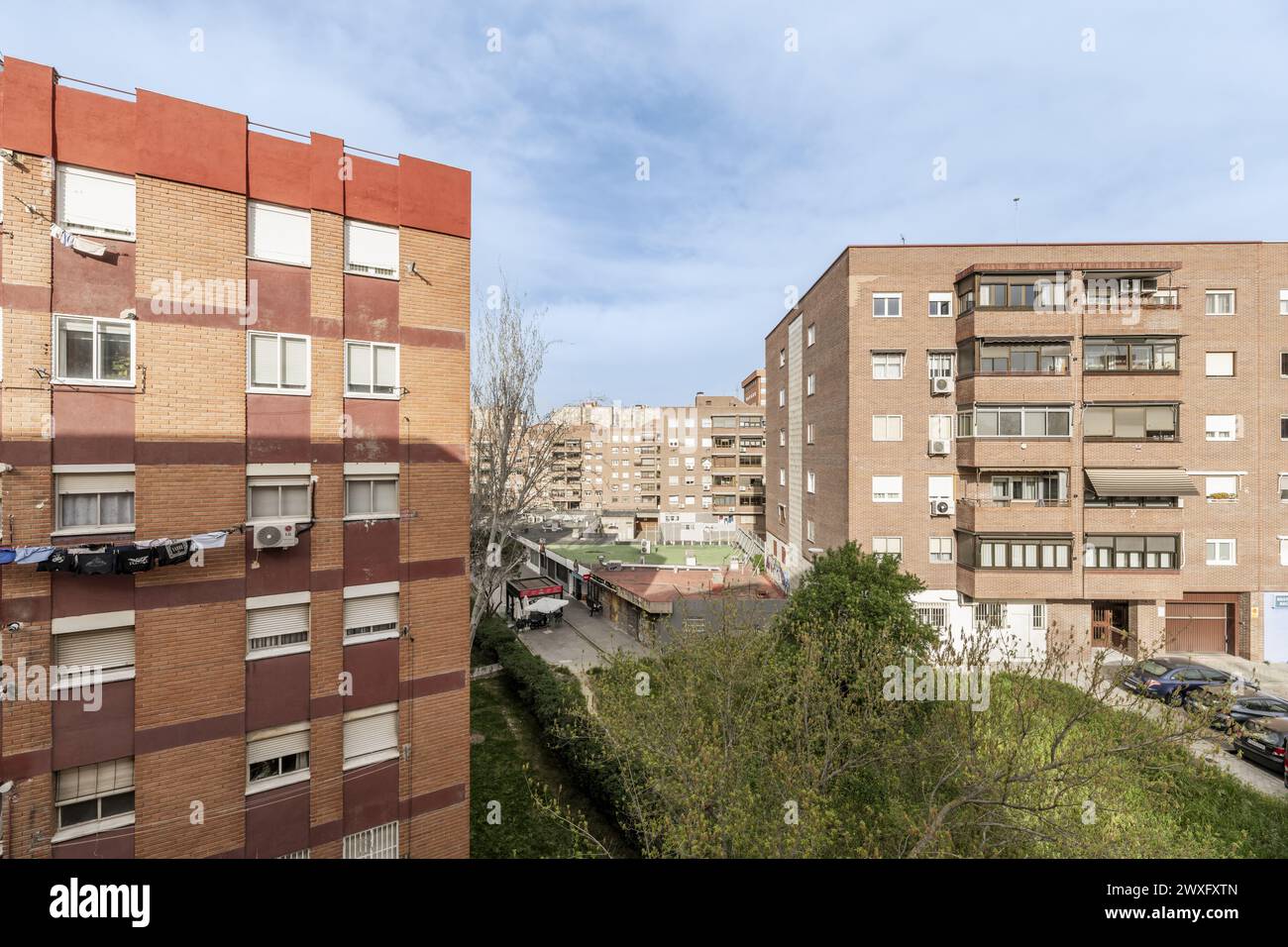 Facades of residential buildings with large green areas with gardens ...