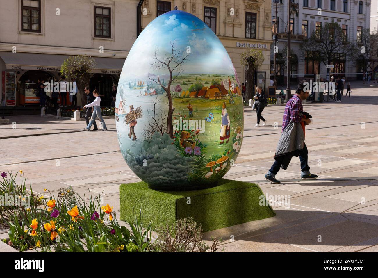 Pecs. 30th Mar, 2024. A two-meter tall Easter egg decoration is seen on ...