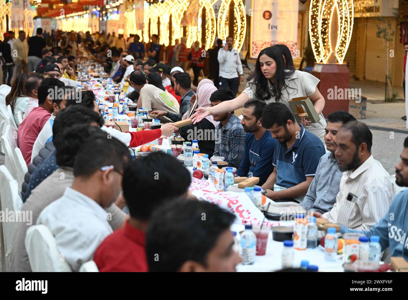 Kuwait City, Kuwait. 30th Mar, 2024. People attend an iftar banquet in ...