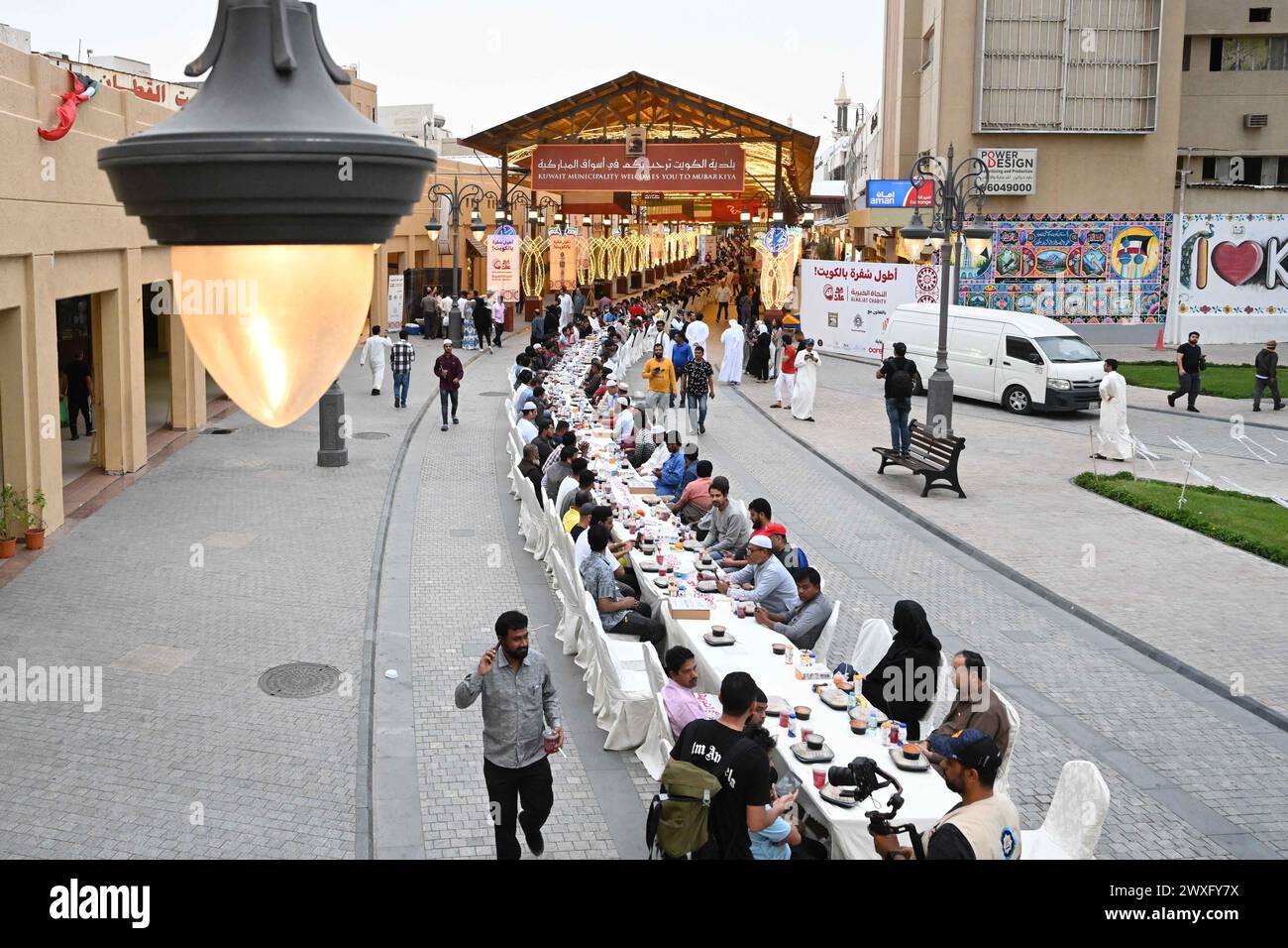 Kuwait City, Kuwait. 30th Mar, 2024. People attend an iftar banquet in ...