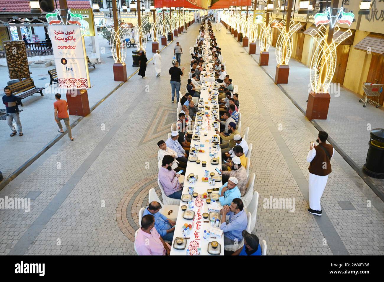 Kuwait City, Kuwait. 30th Mar, 2024. People attend an iftar banquet in ...