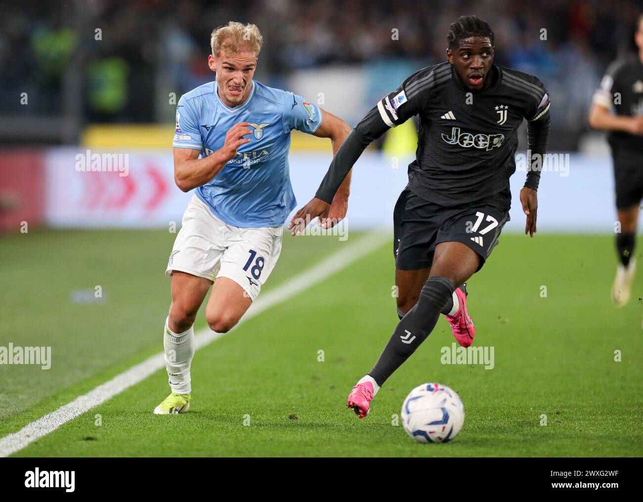 Rome, Italy. 30th Mar, 2024. Lazio's Gustav Isaksen (L) vies with ...