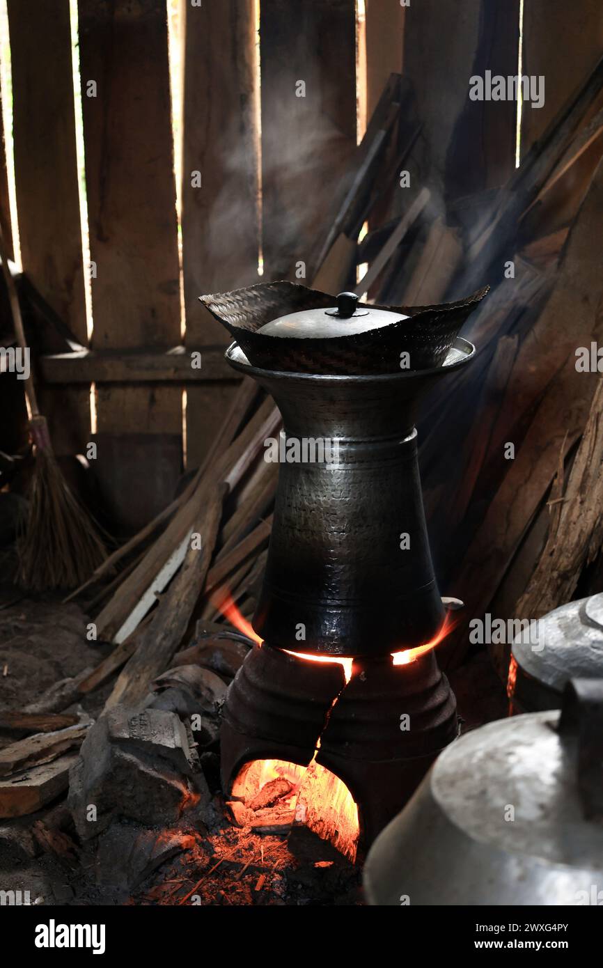 Steam Rice in Indonesian Traditional Kitchen using Kayu Bakar Stock ...