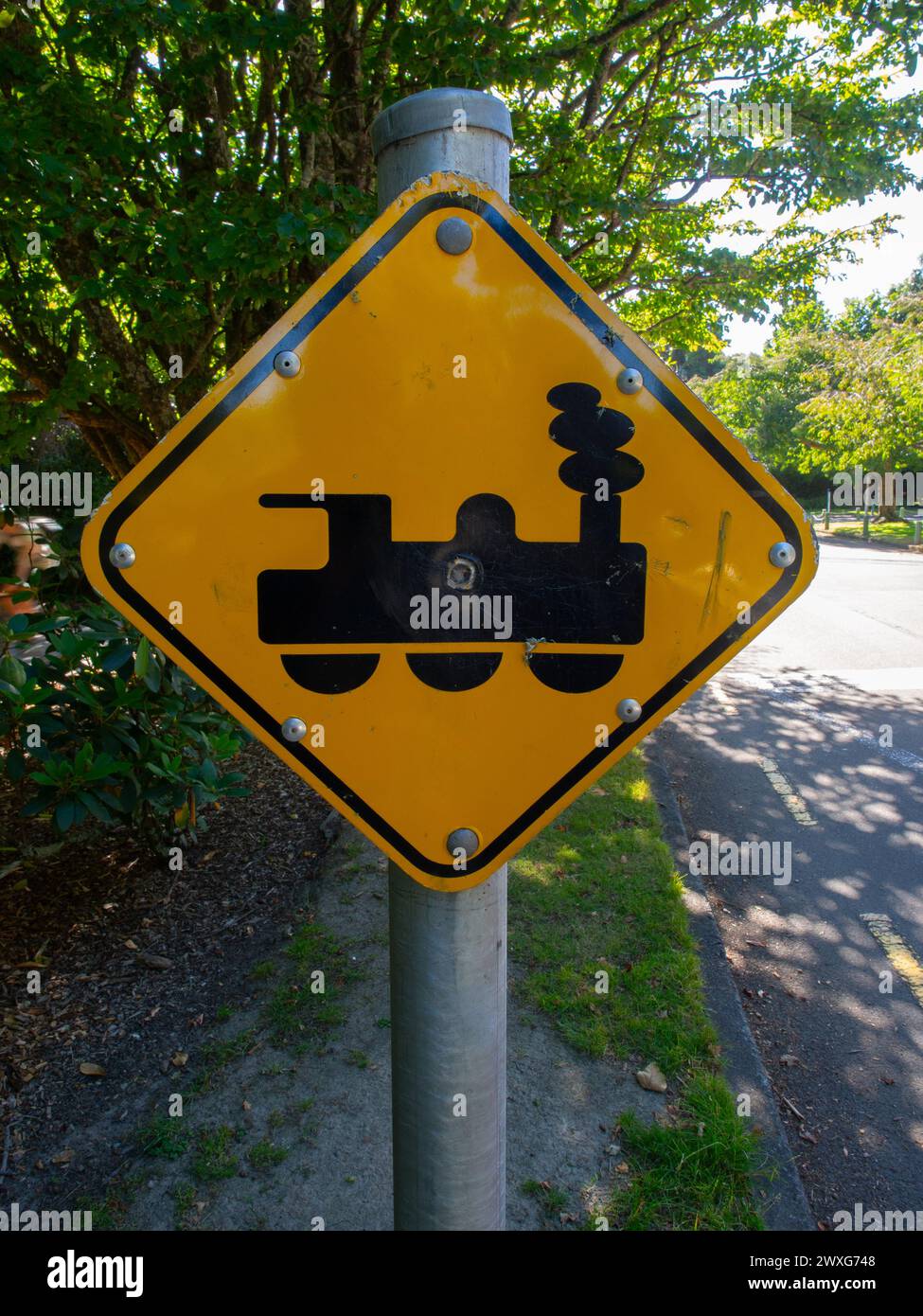 Train Road Sign In Black On A Yellow Background Stock Photo - Alamy