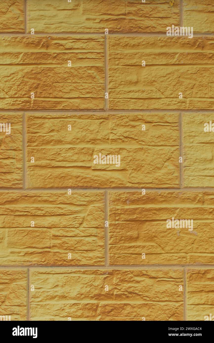Yellow bright vibrant paint large brick blocks masonry wall texture ...