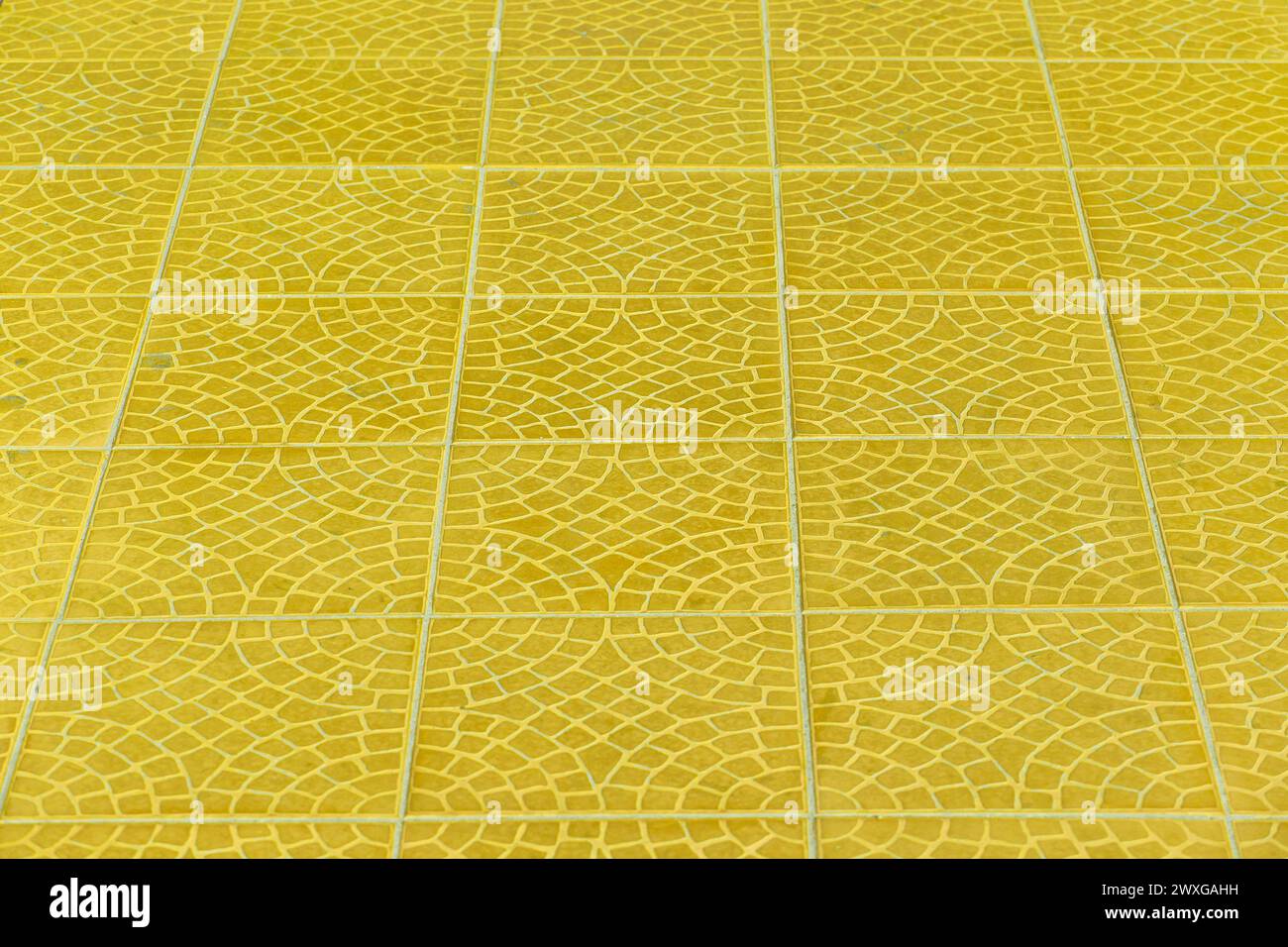 Bright yellow floor tile stone ceramic abstract mosaic pattern surface ...